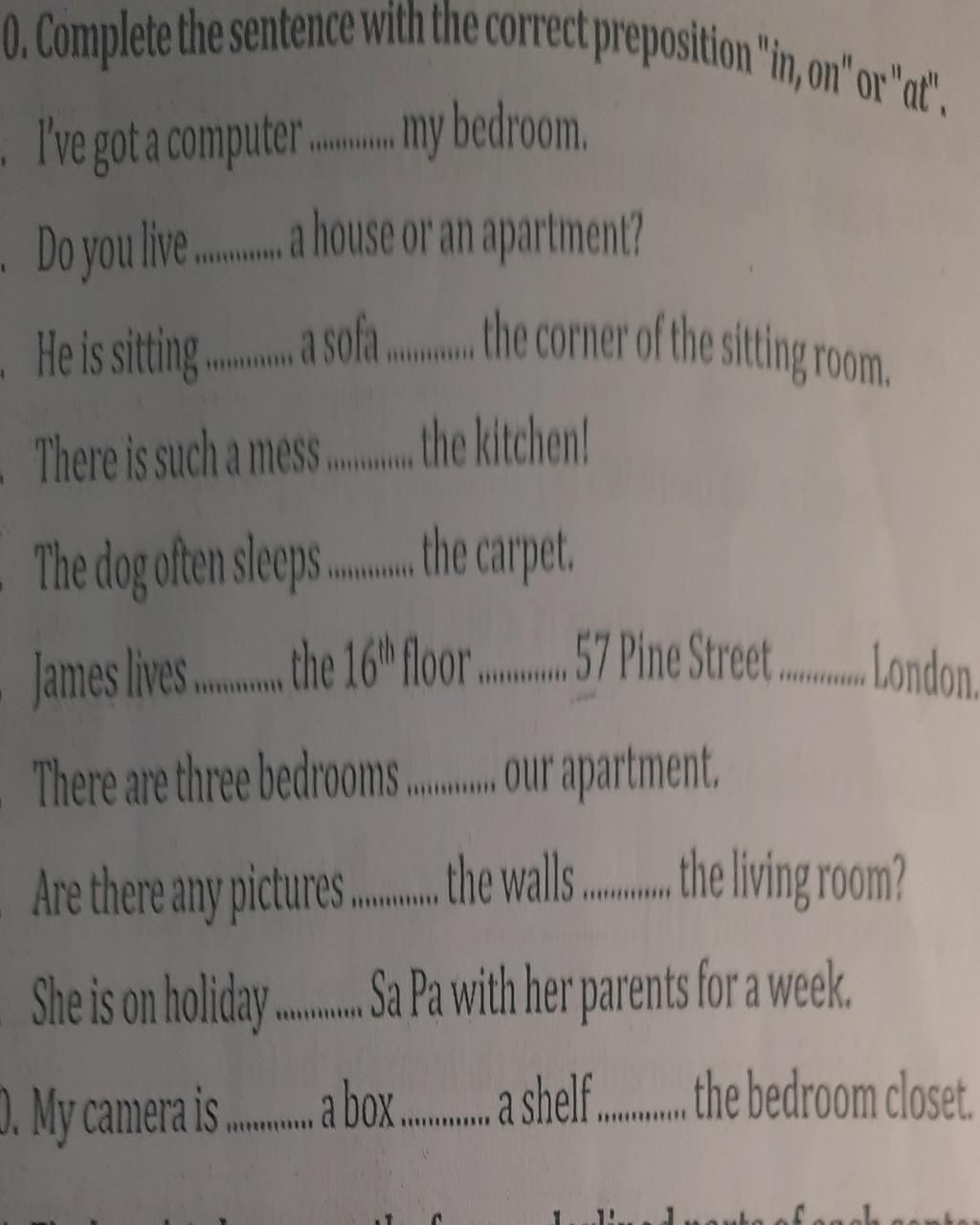 0. Complete the sentence with the correct preposition "in, on" or "at ...